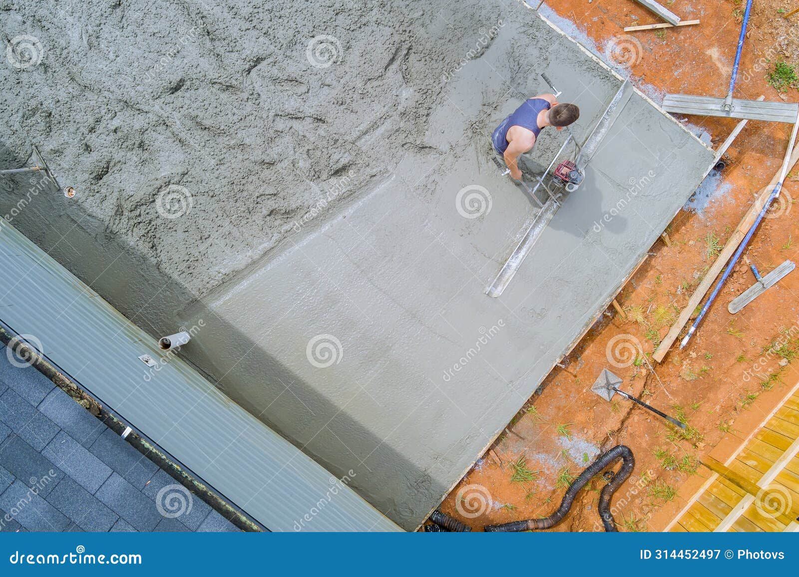 Leveling Concrete by Using Special Tool by a Construction Worker Stock ...