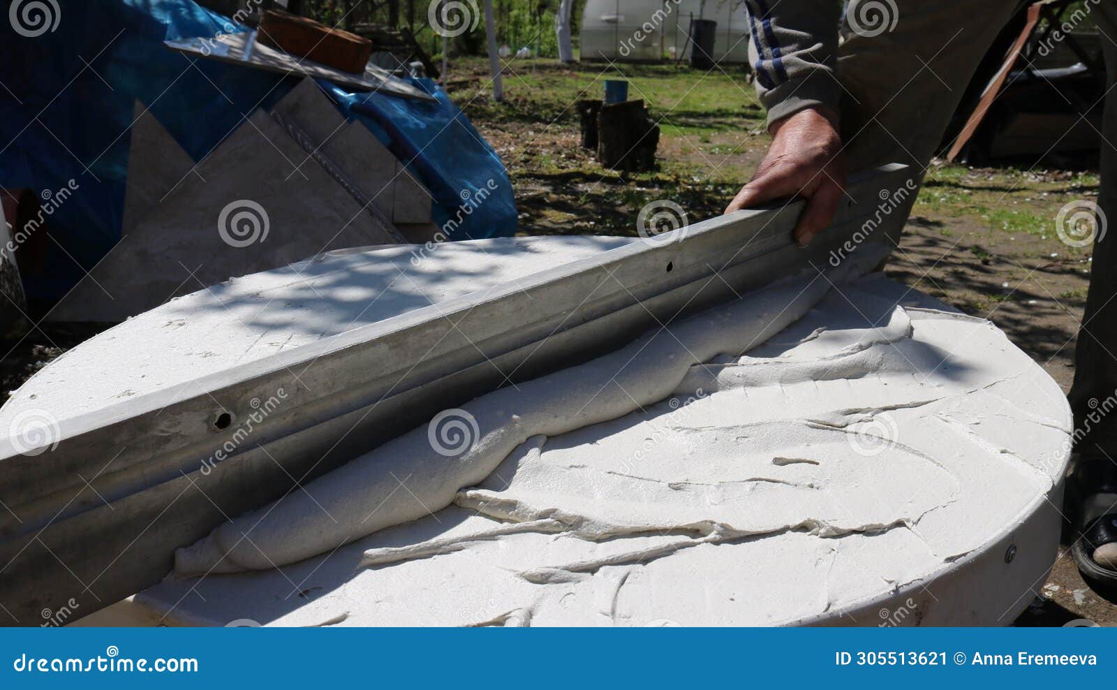 Leveling the Mastic on the Surface Using a Long Bar Stock Image - Image ...