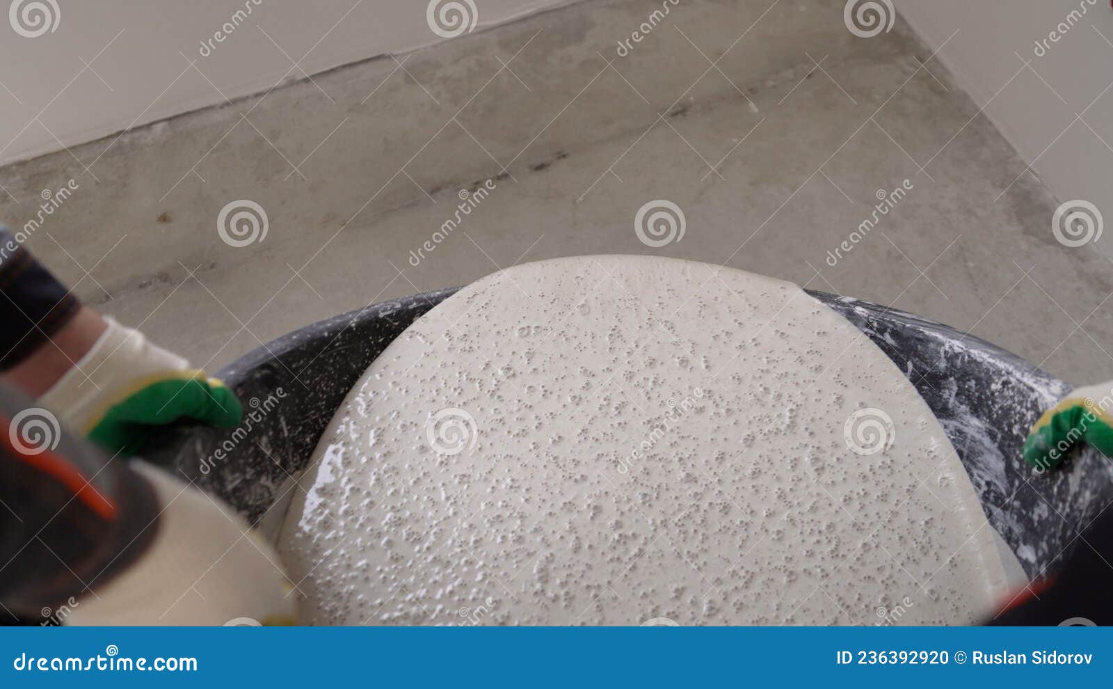 Leveling with a Mixture of Cement Floors. Finishing Work - the Worker ...