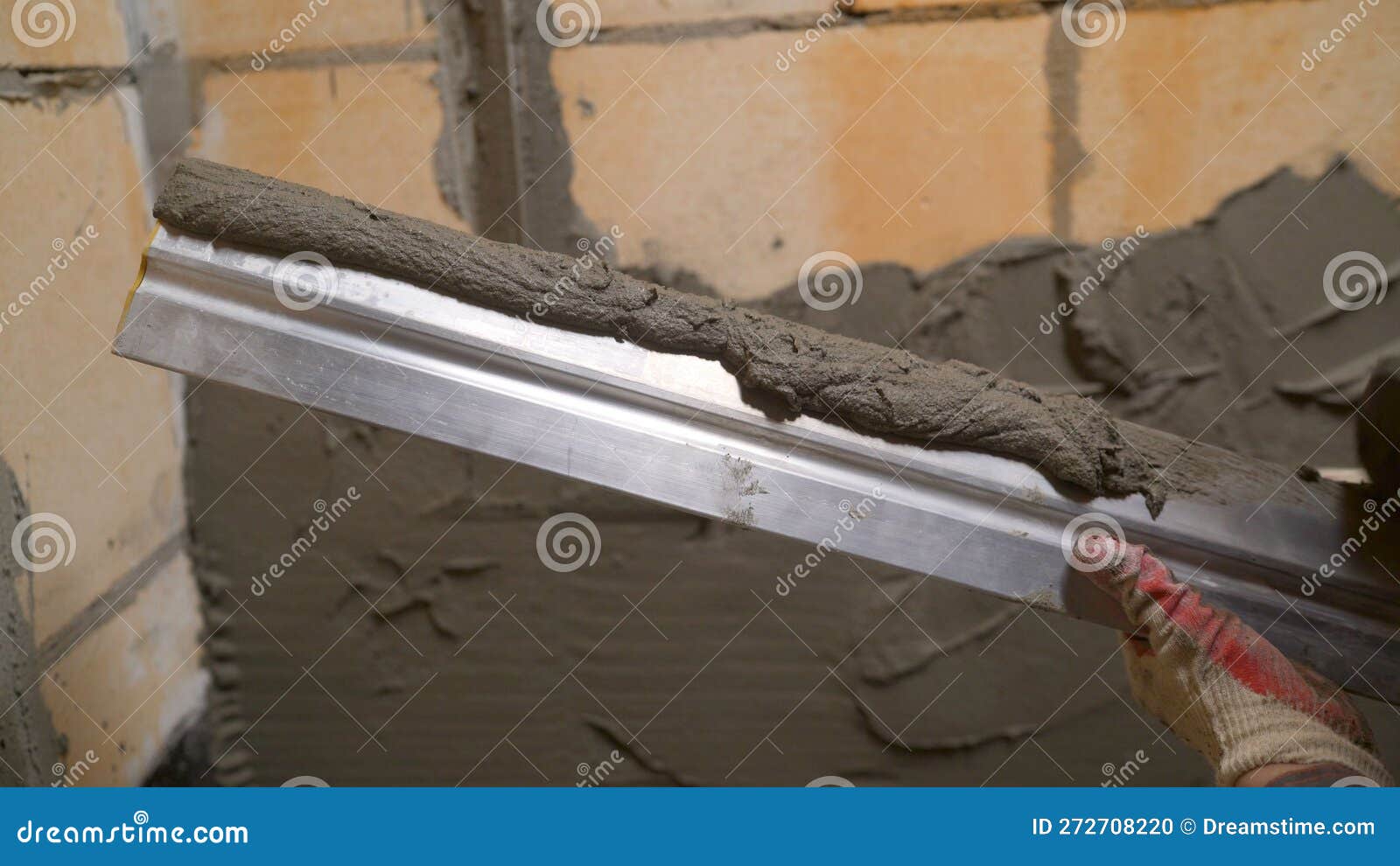 View of Builder Hands Plastering on Block Wall. Worker Leveling the ...