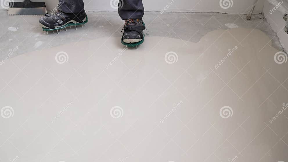 Leveling the Solution, Self-leveling Liquid Floor. the Worker Pours the ...