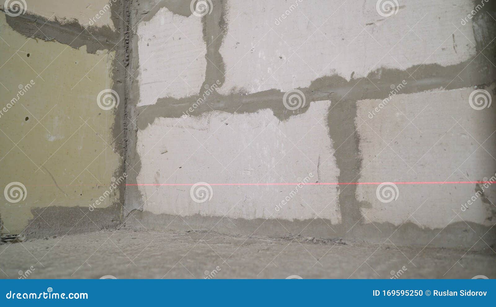 Leveling the Wall with a Laser Level. Lighted Laser Level. Display ...