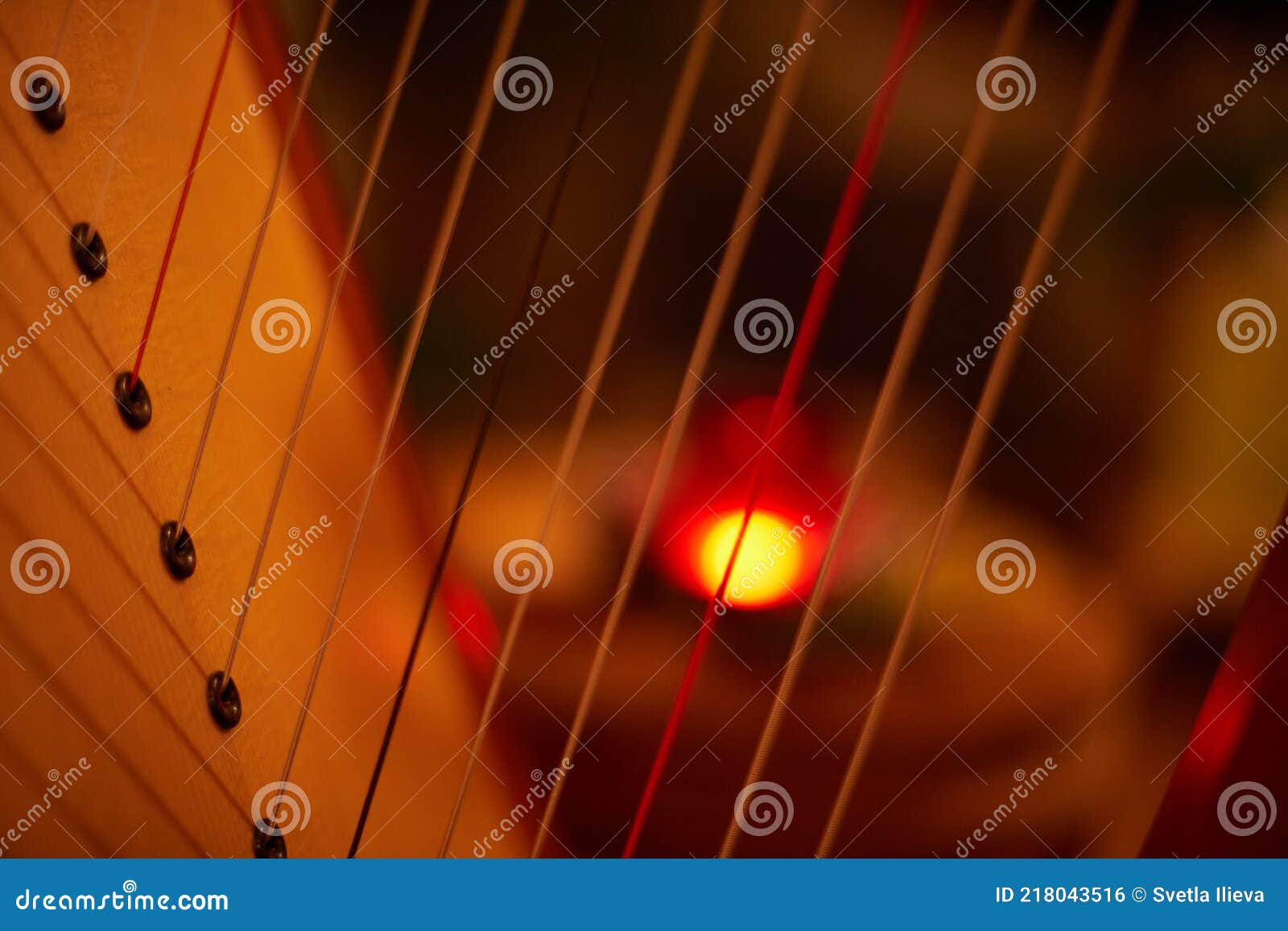 Harp strings with candle stock photo. Image of lights - 218043516