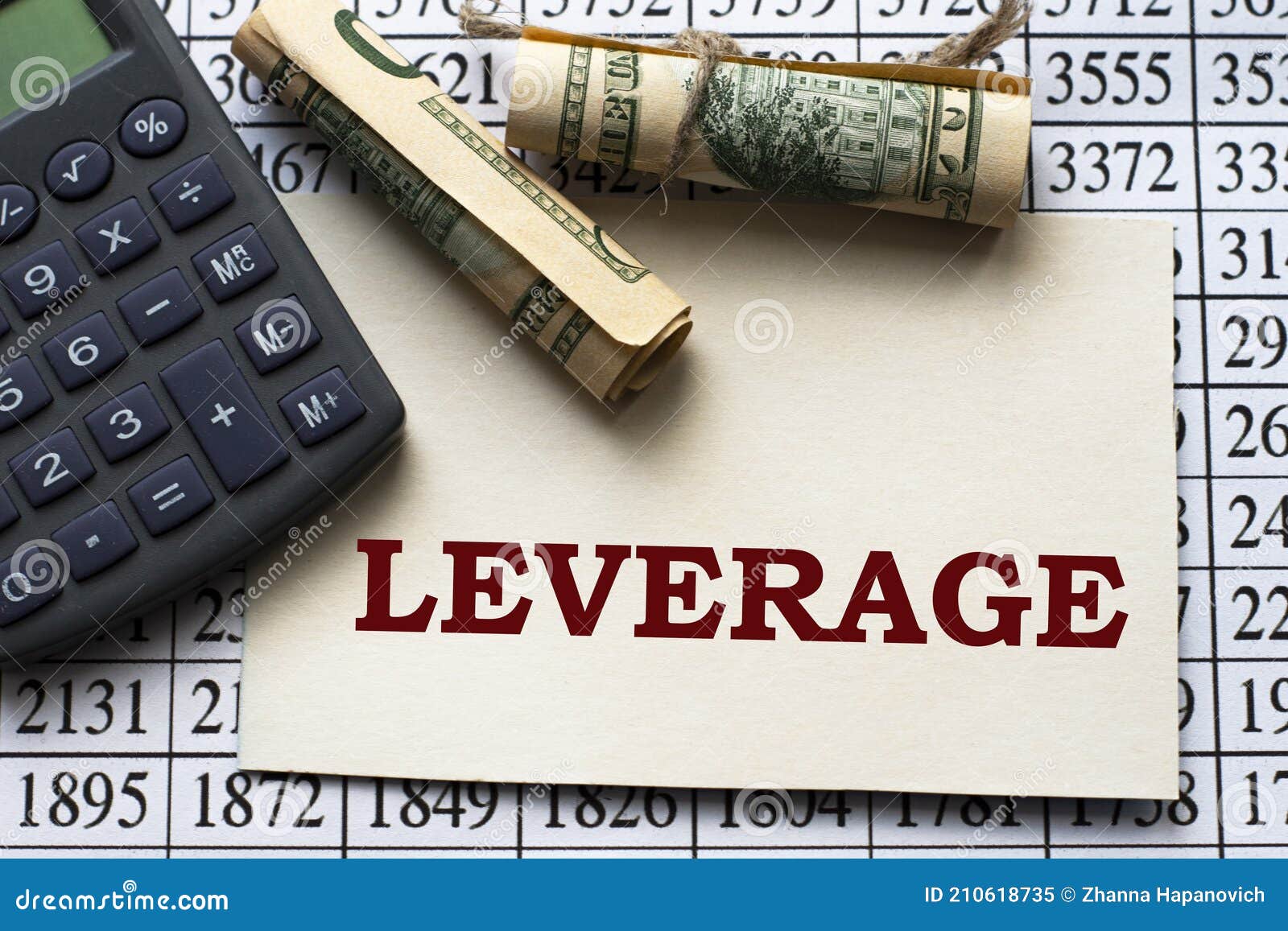 LEVERAGE Word on a White Sheet Against a Table with Numbers, Banknotes ...