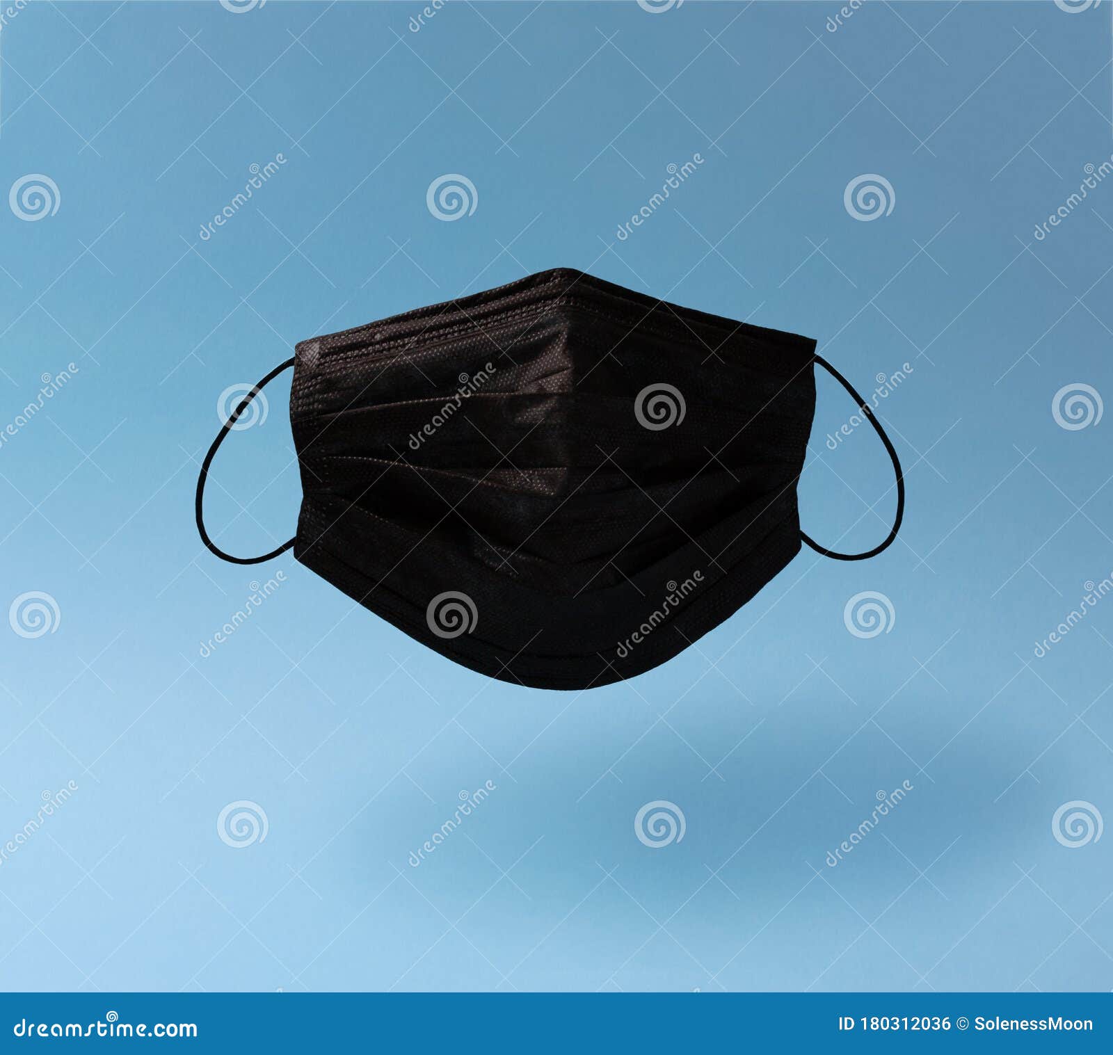 Levitating Real Black Surgical Mask with Soft Shadow on a Blue ...