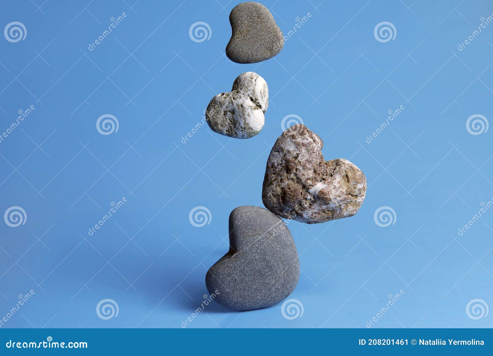 Levitation. Falling Stones in the Shape of a Heart on a Blue Background ...