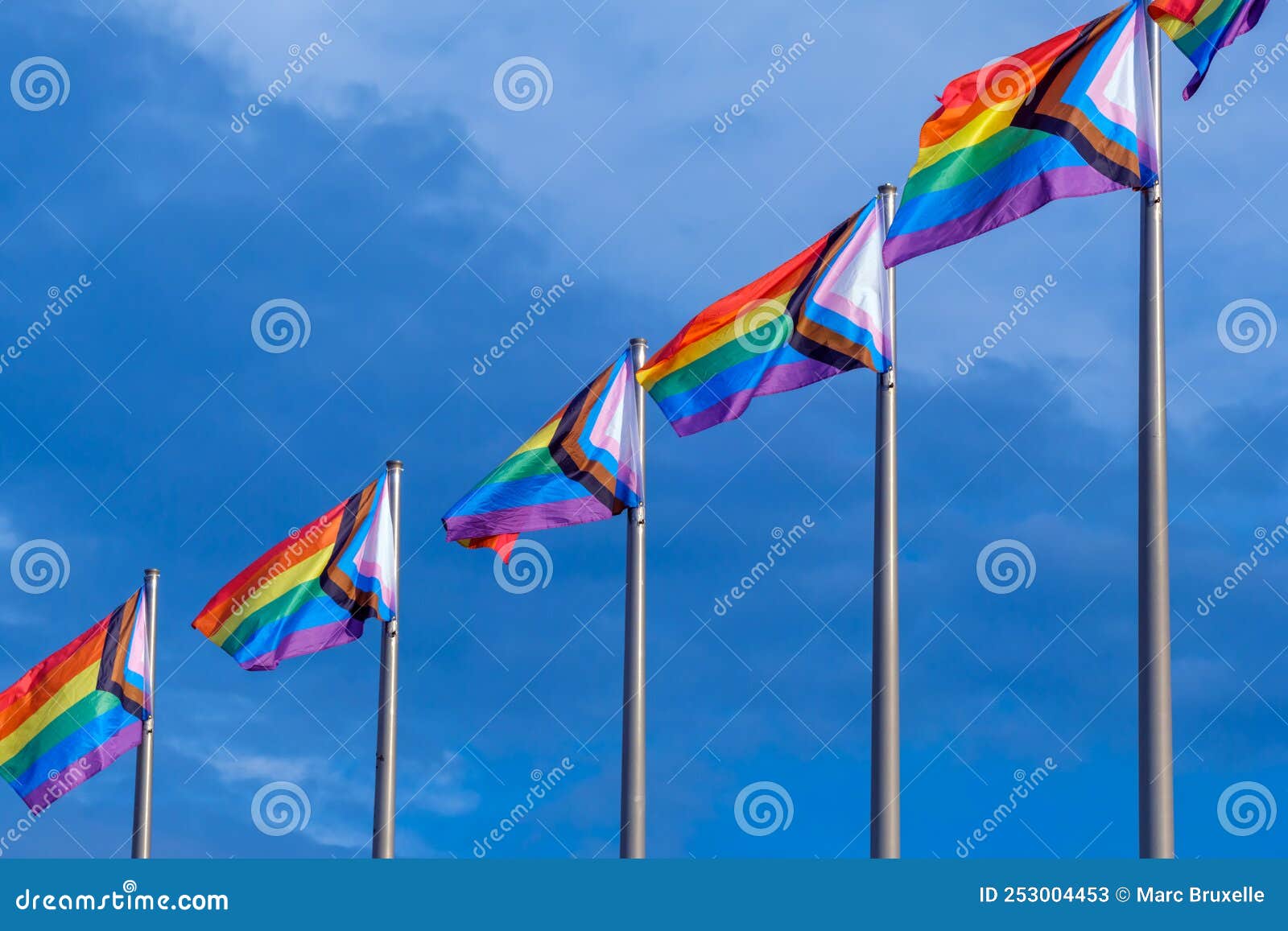 Progress Pride Flags Waving Over Blue Sky Stock Image - Image of ...