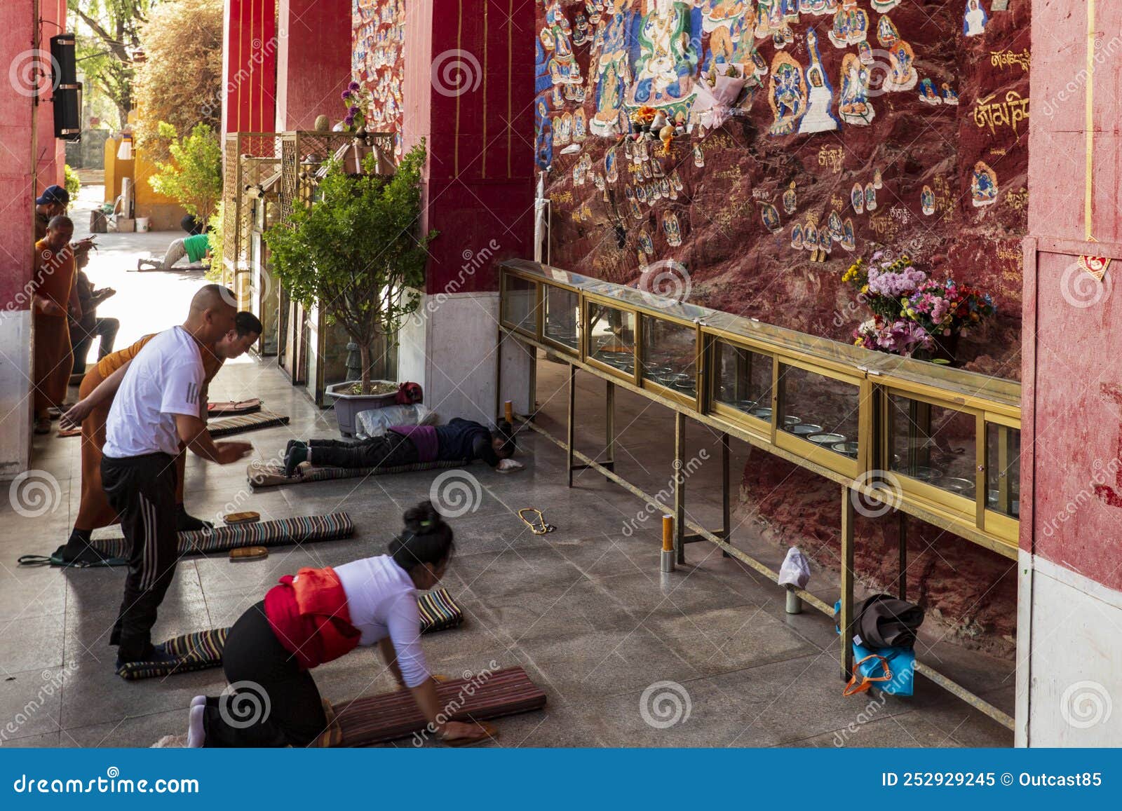 Lhasa, Tibet - August 3, 2022: Tibetan People Performing Prostrations ...