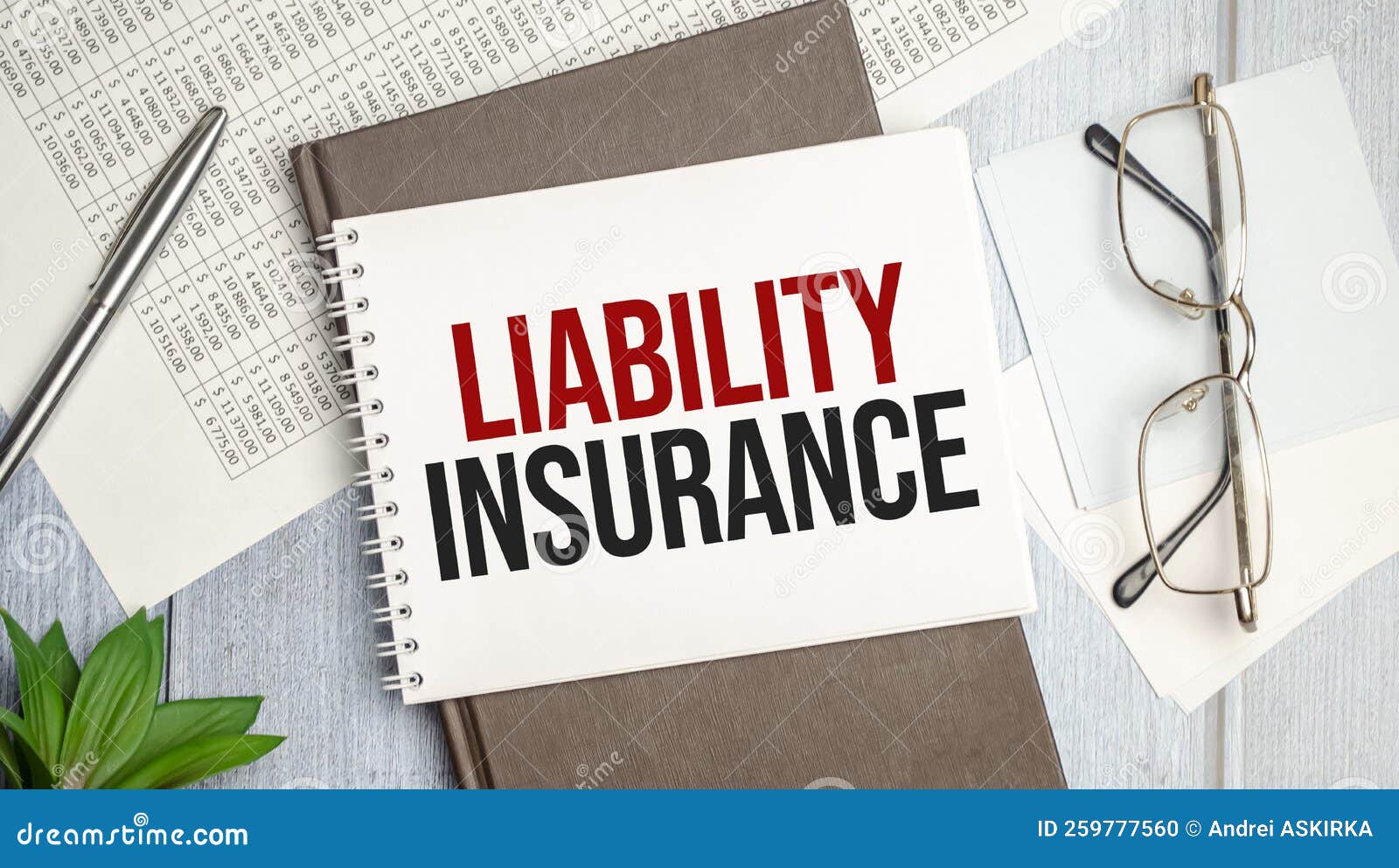 LIABILITY INSURANCE Words on Notepad and Pen with Charts on Blue ...