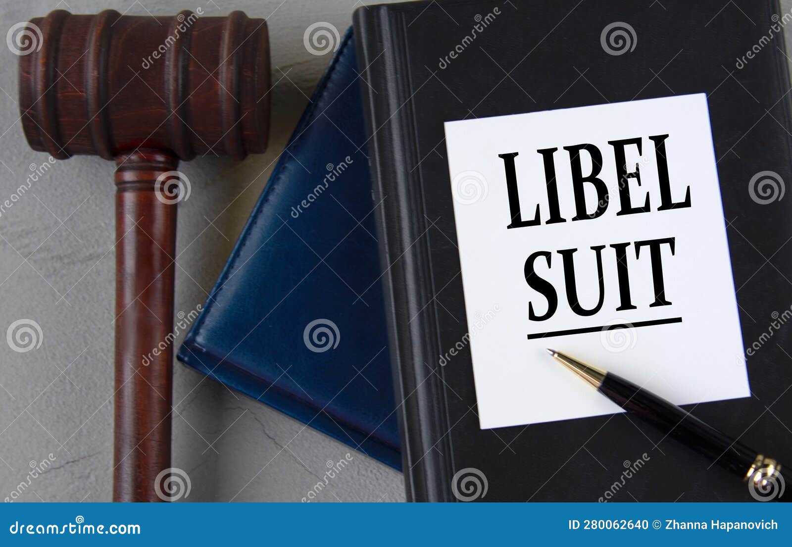 LIBEL SUIT - Words on a White Sheet with Leather Notebooks, a Judge S ...
