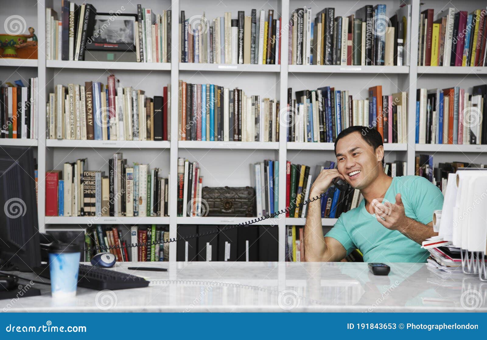Librarian Sitting and Talking on Telephone Stock Image - Image of ...