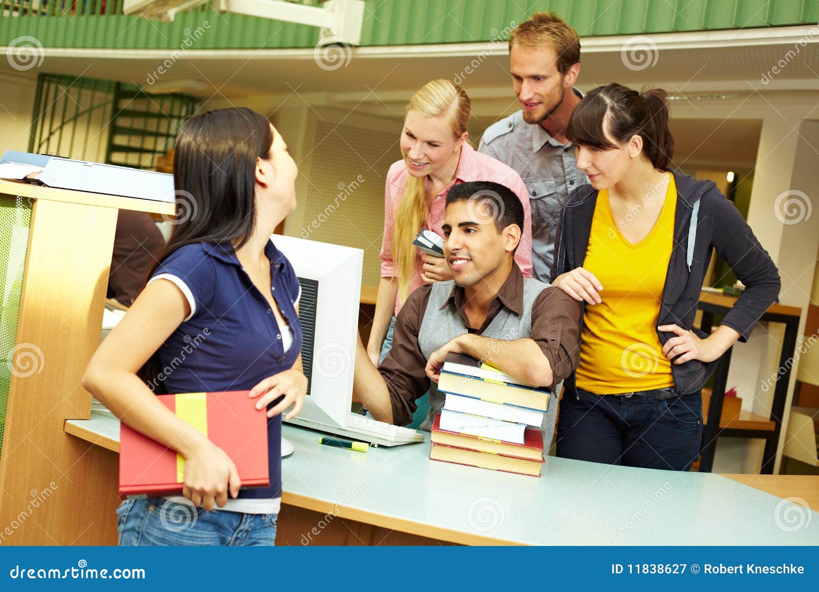 Librarians helping student stock image. Image of staff - 11838627