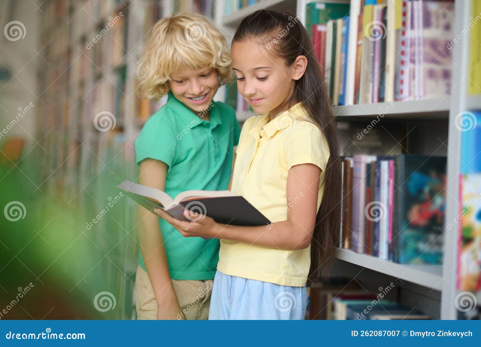 Classmates Reading Together in a School Library Stock Image - Image of ...