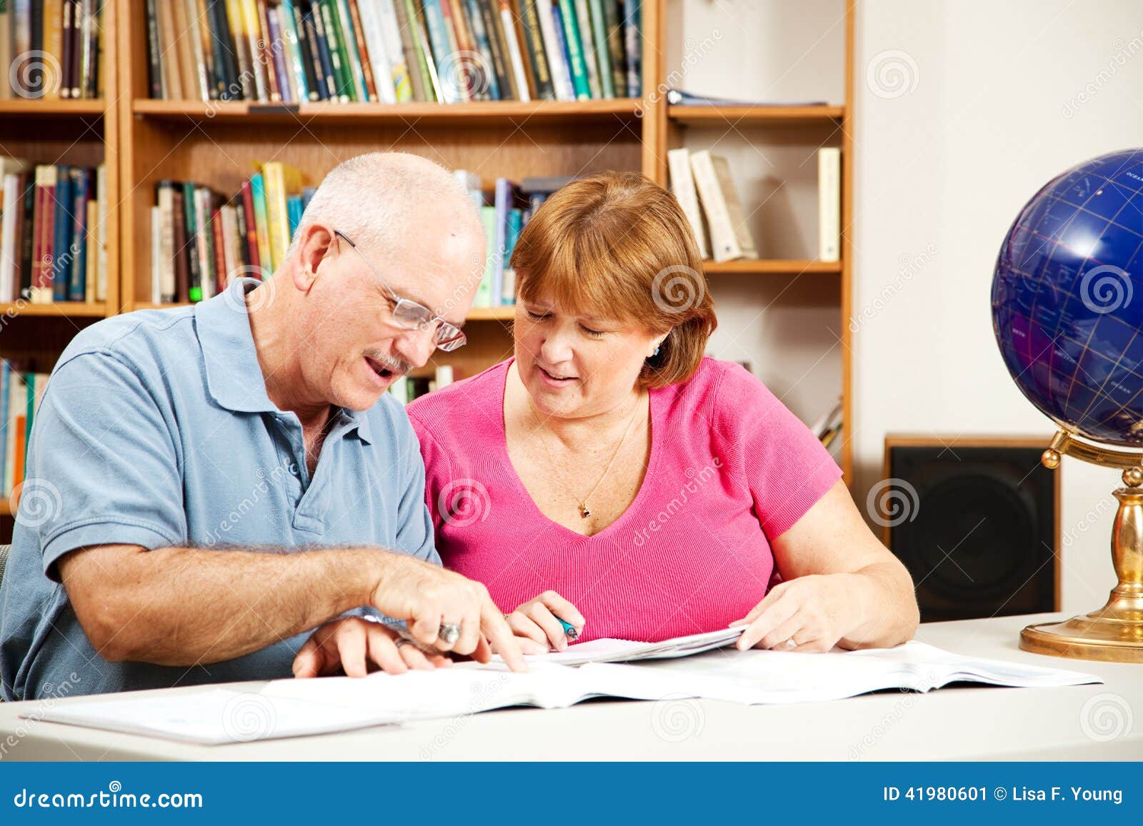 Library - Couple Studying stock image. Image of female - 41980601