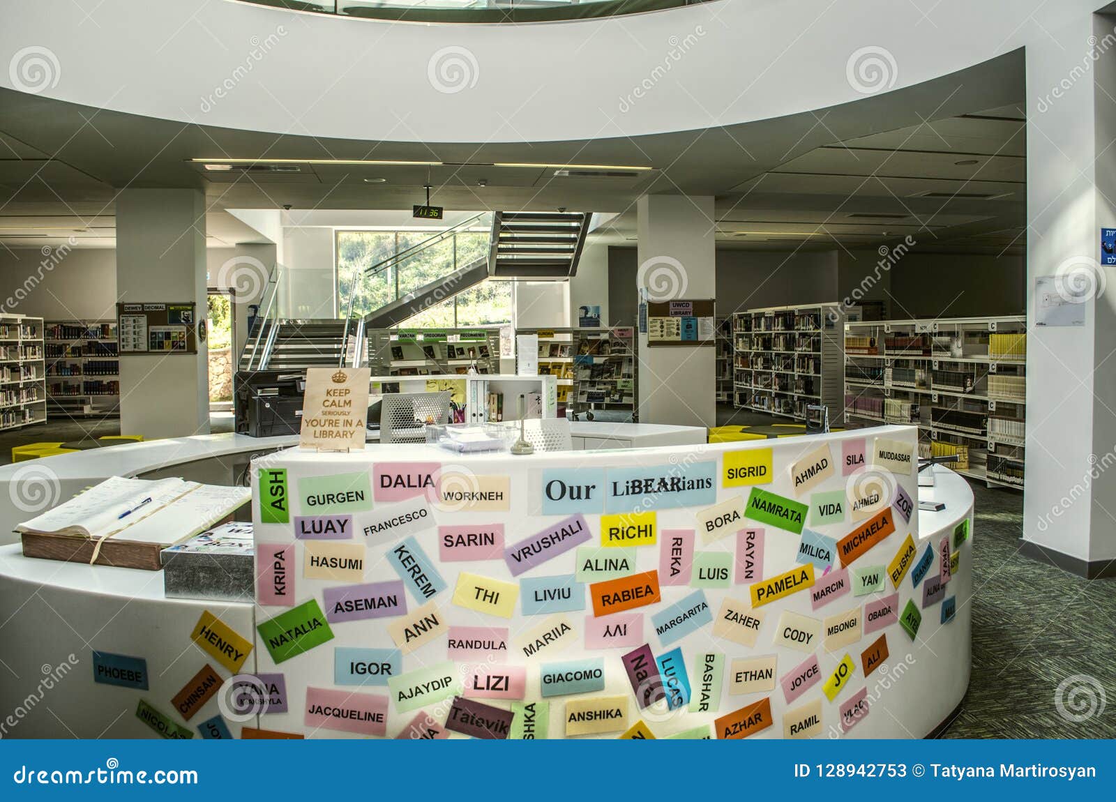 Library with an Oval Table for Performing Duty, the Names of Students ...