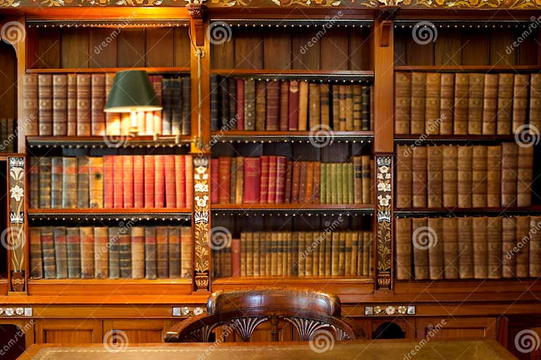 Library shelves and table stock image. Image of library - 20784999