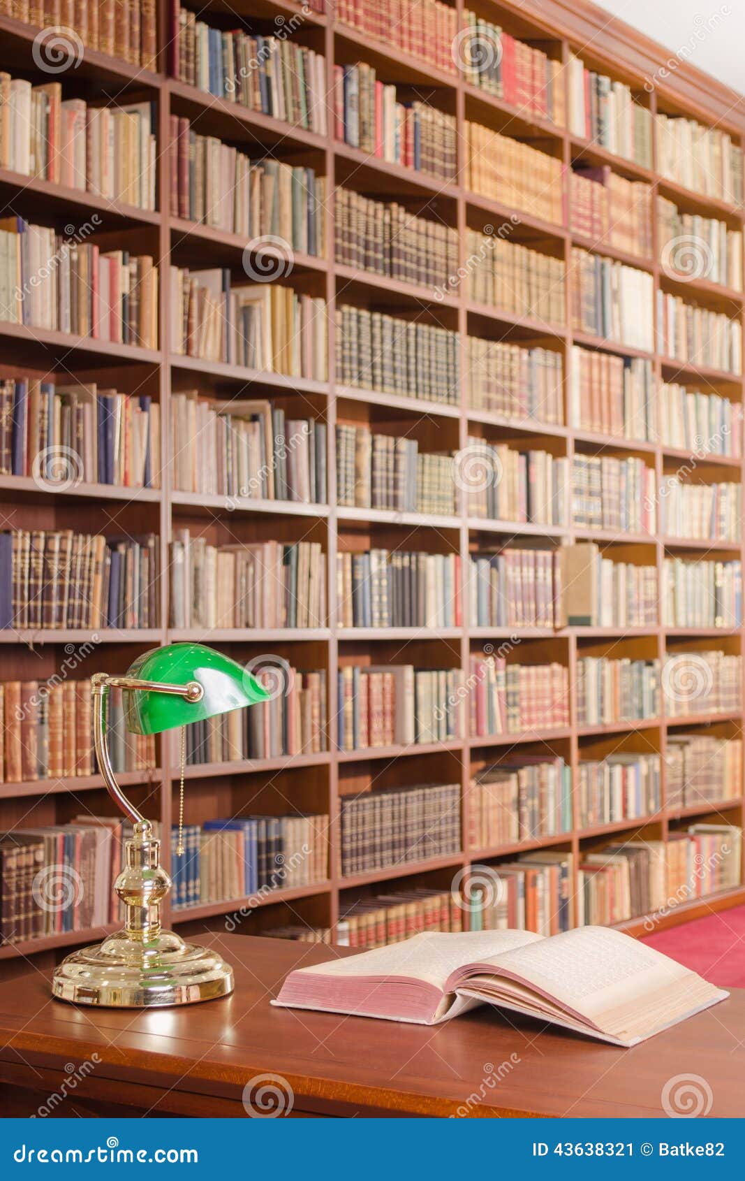 Library Table with Bookshelf in the Background Stock Image - Image of ...