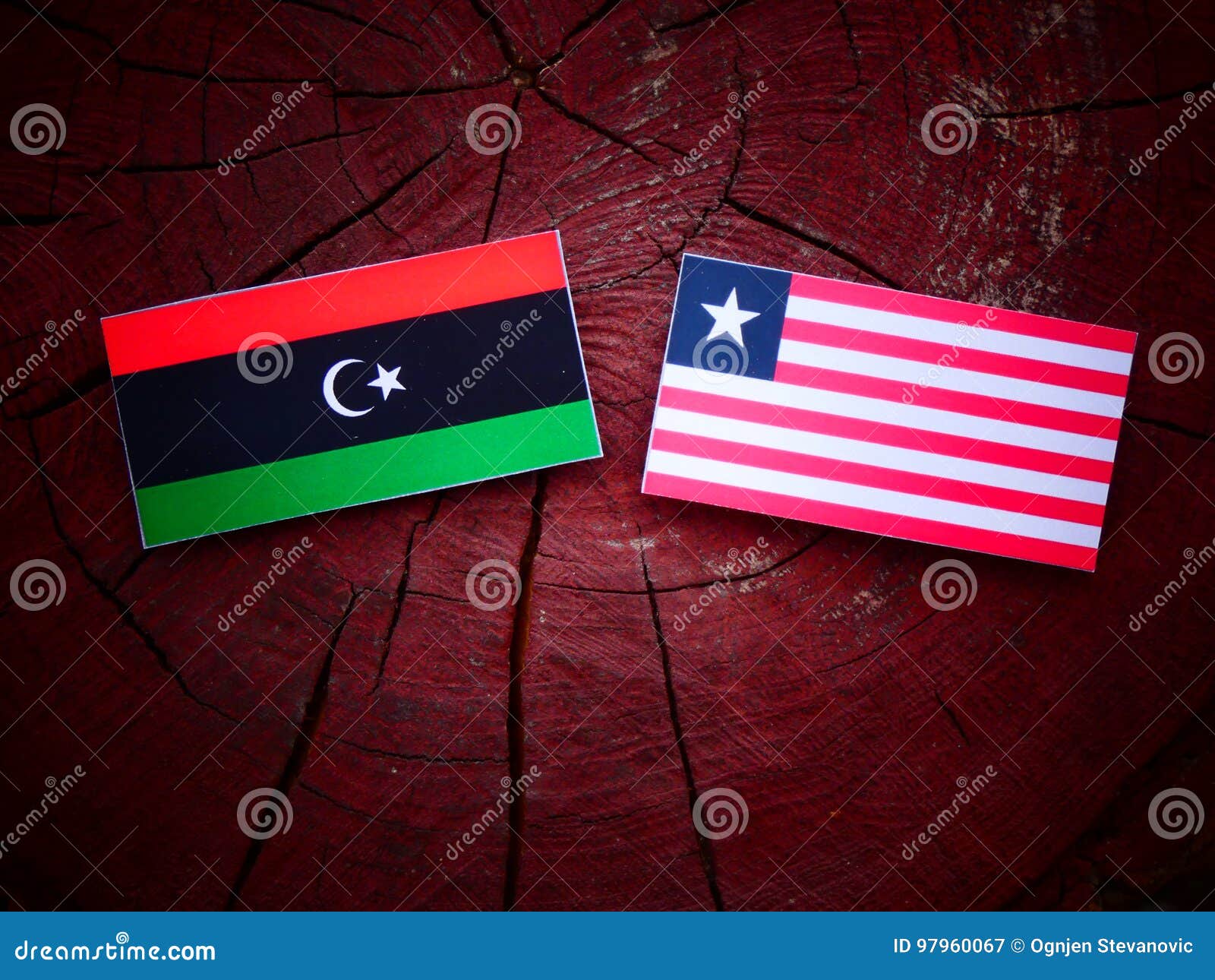 Libyan Flag with Liberian Flag on a Tree Stump Isolated Stock Image ...