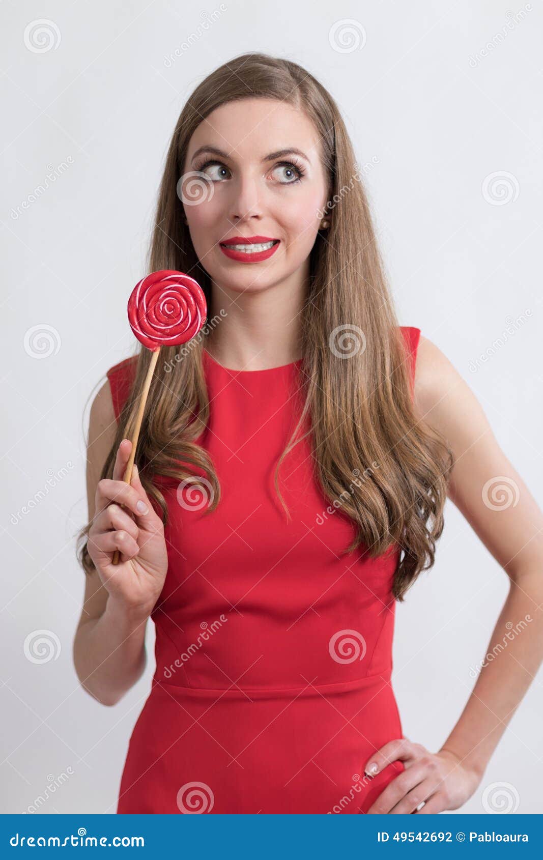 Licking a red lollipop stock photo. Image of adult, color - 49542692