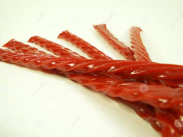 Red Licorice Ropes Fanned Out Isolated on White Stock Photo - Image of ...
