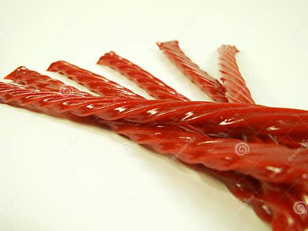 Red Licorice Ropes Fanned Out Isolated on White Stock Photo - Image of ...