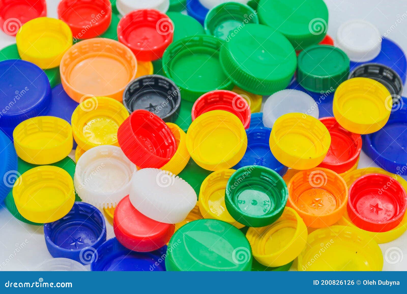 Plastic Lids of Different Colors on a White Background Stock Photo ...