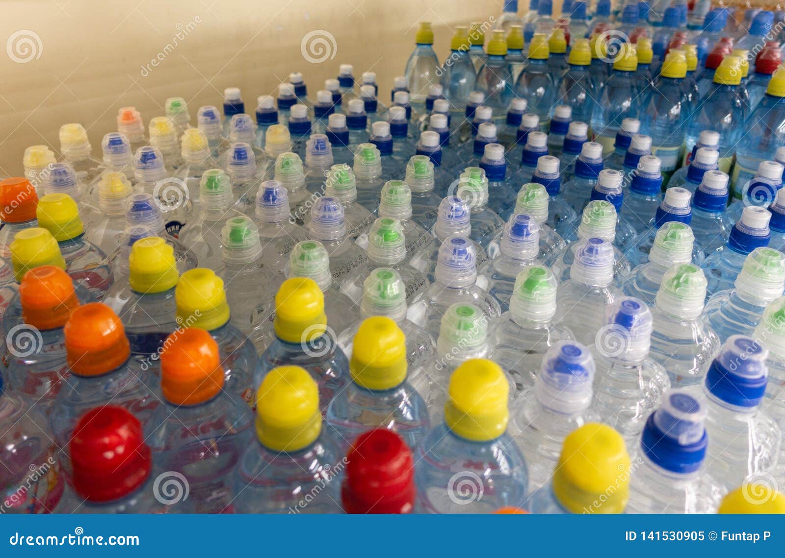 Lid Plastic Water Bottle in the Market Multi-colored Plastic Bottle ...