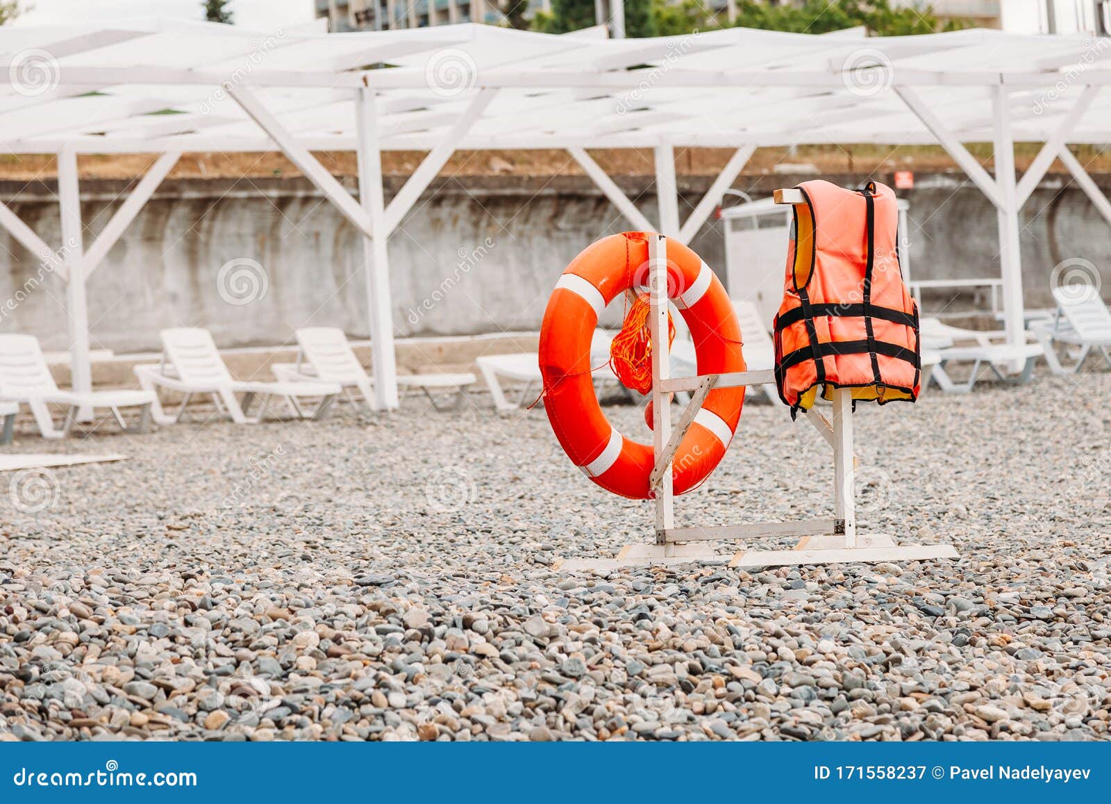Life Buoy on Beach and Life Jacket Stock Image - Image of water, jacket ...