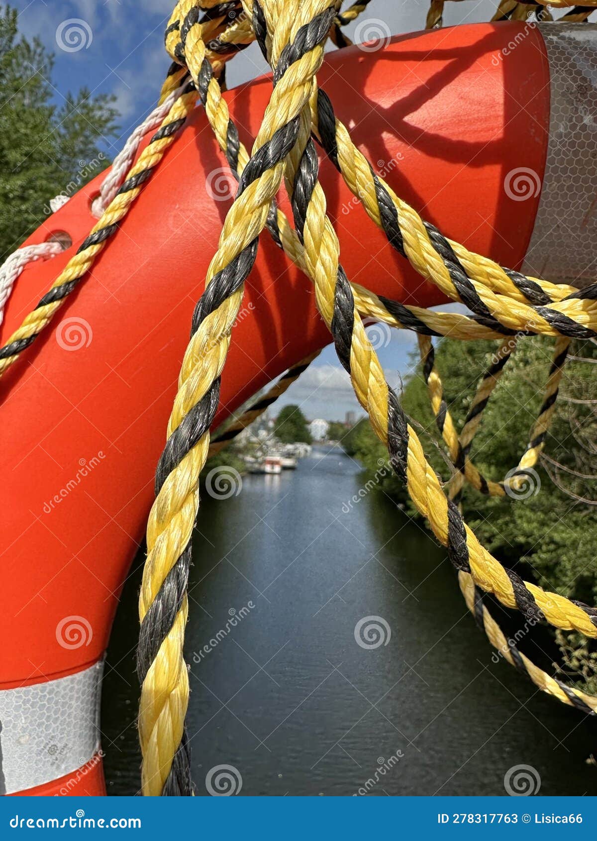 Life Buoy with a Rope Over the River Stock Image - Image of vertical ...
