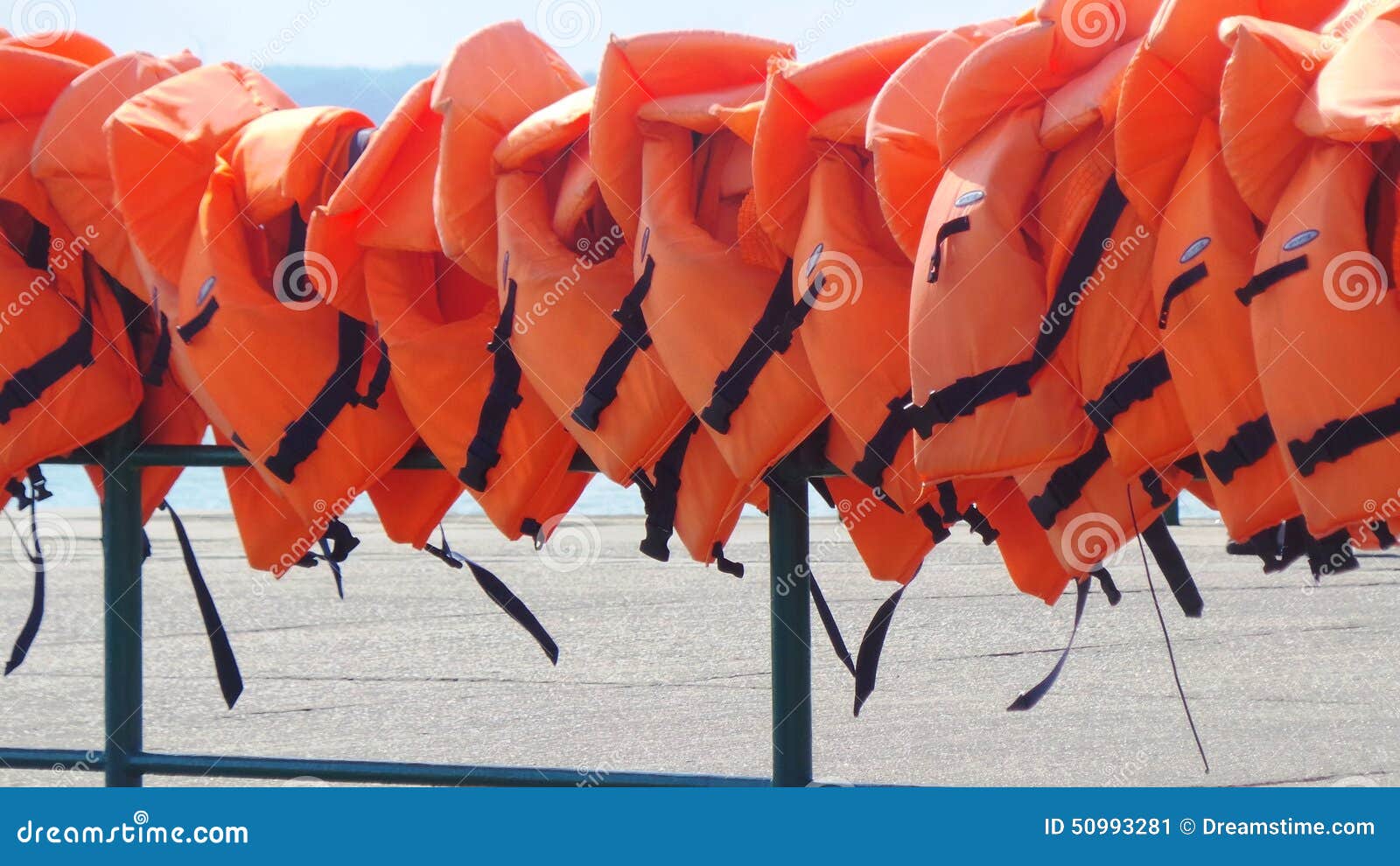 Life Jackets Hang On A Rope On The Shore Against The Backdrop Of ...