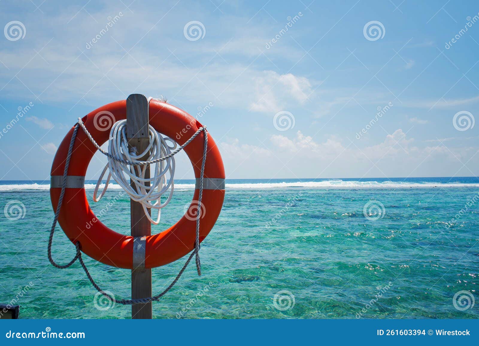 Life preserver on beach stock photo. Image of travel - 261603394