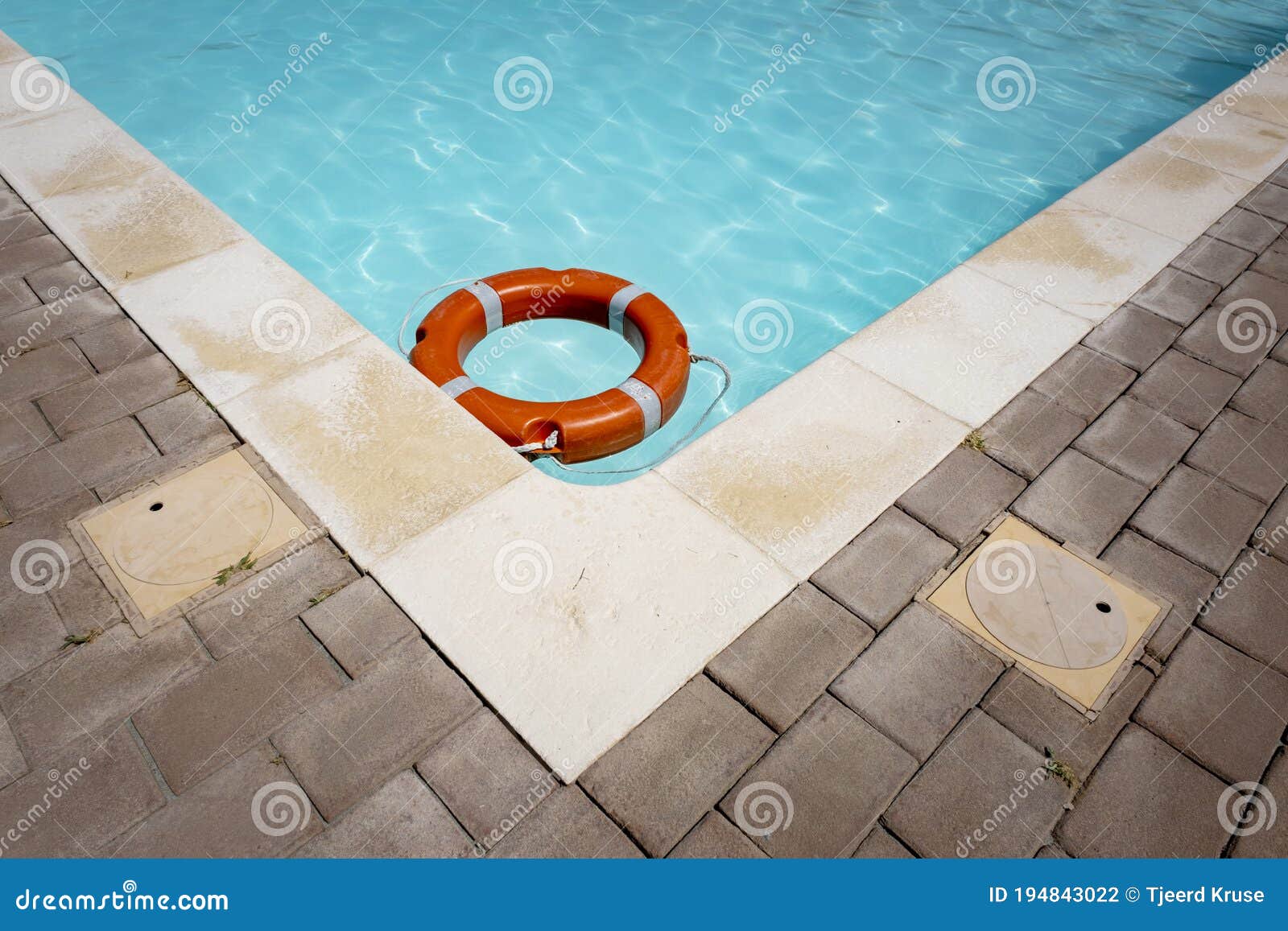 Life Preserver Floating in a Clear Pool Water Stock Photo - Image of ...
