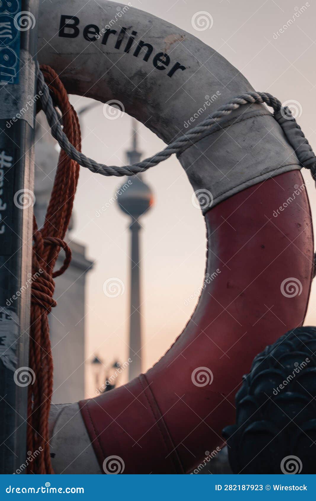 Life Preserver Hangs from a Tall Tower in a Body of Water Stock Image ...