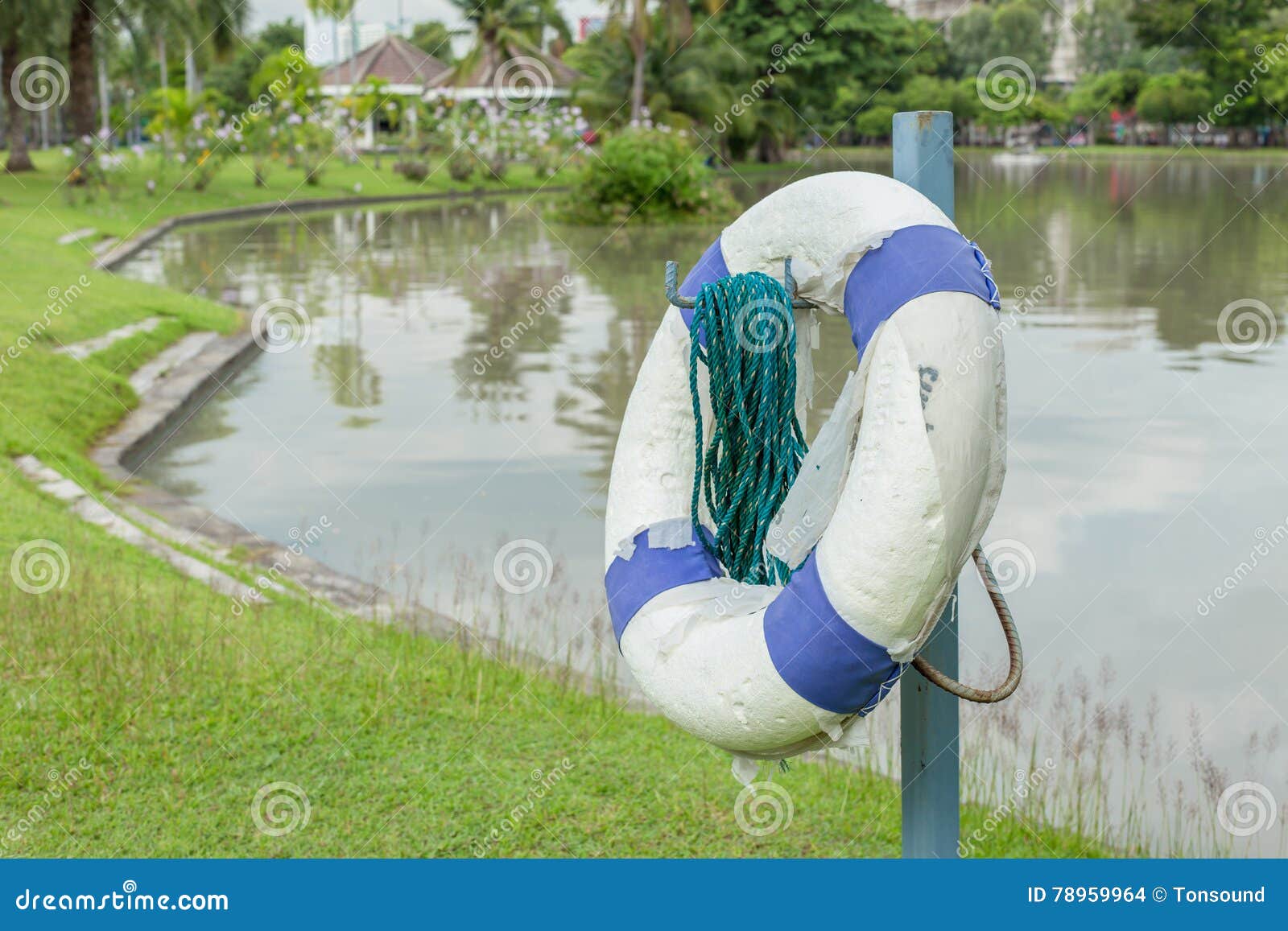 Life Preserver on Pole at Lake at Day Time. Stock Photo - Image of ...