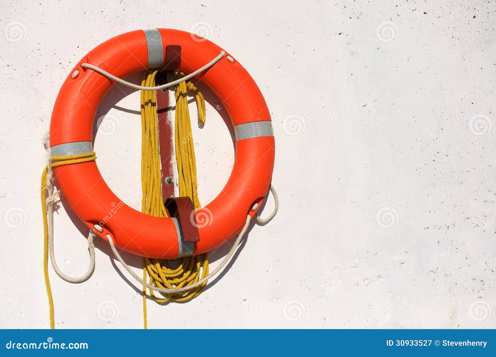 Life Preserver on White Concrete Background Stock Image - Image of ...