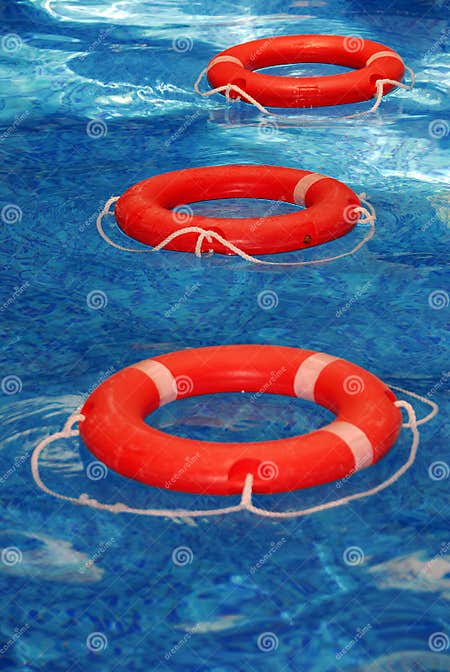 Life preservers in pool stock photo. Image of color, device - 13866012