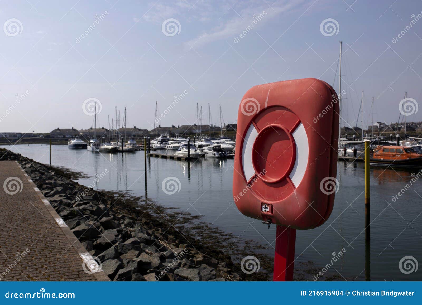 Life Saving Emergency Floatation Ring on the Side of a Marina Stock ...