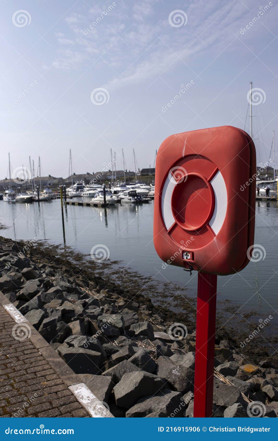Life Saving Emergency Floatation Ring on the Side of a Marina Stock ...