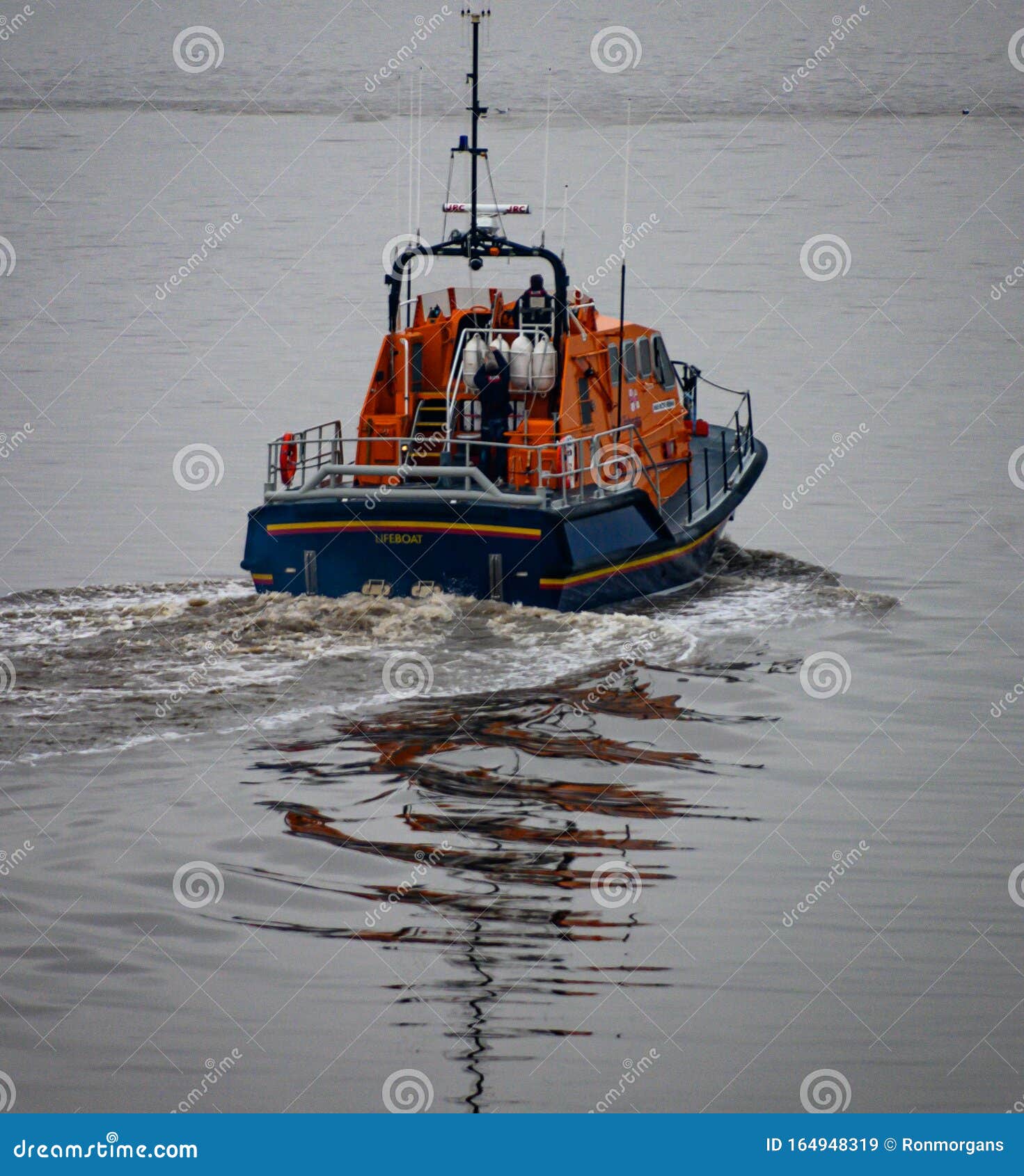 A lifeboat puts to sea stock image. Image of lines, tide - 164948319