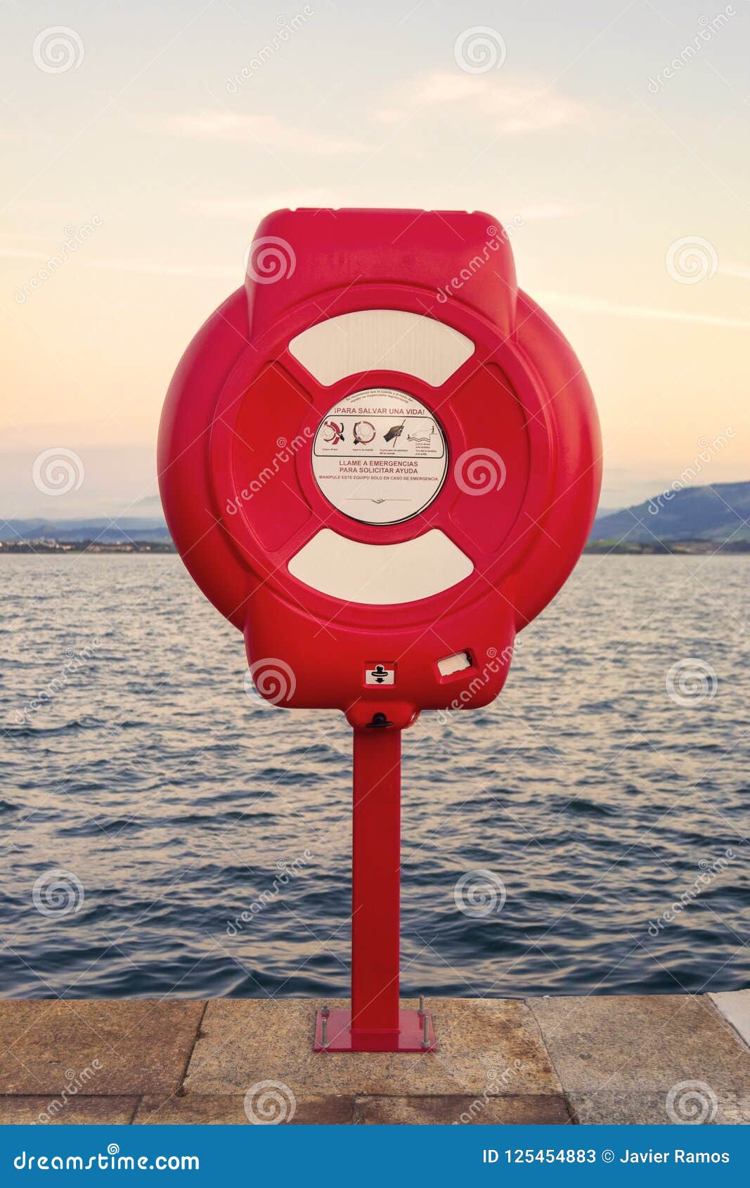 Lifebuoy Inside Its Protective Box at the Edge of the Sea. Front Stock ...