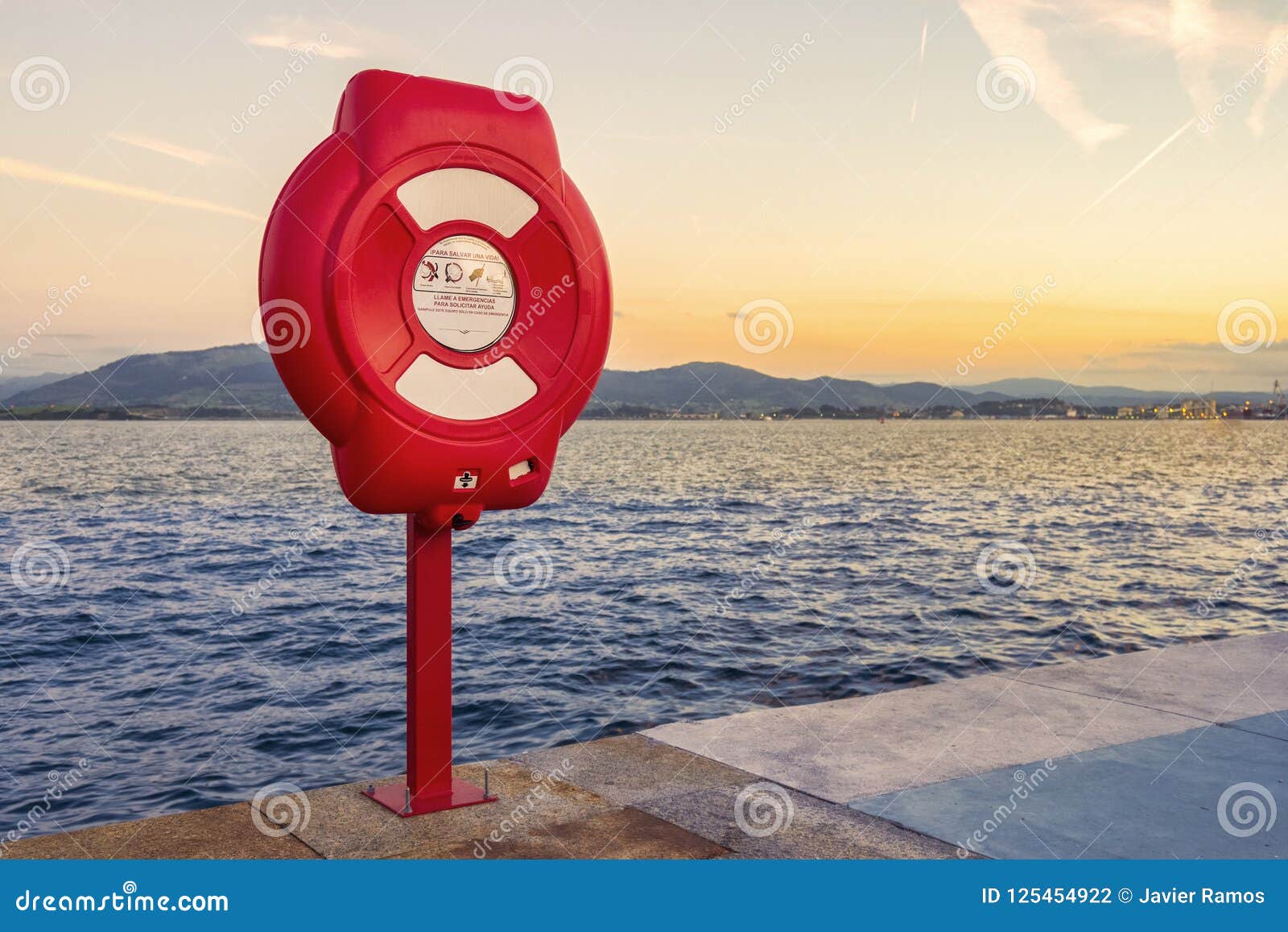 Lifebuoy Inside Its Protective Box at the Edge of the Sea. Perspective ...