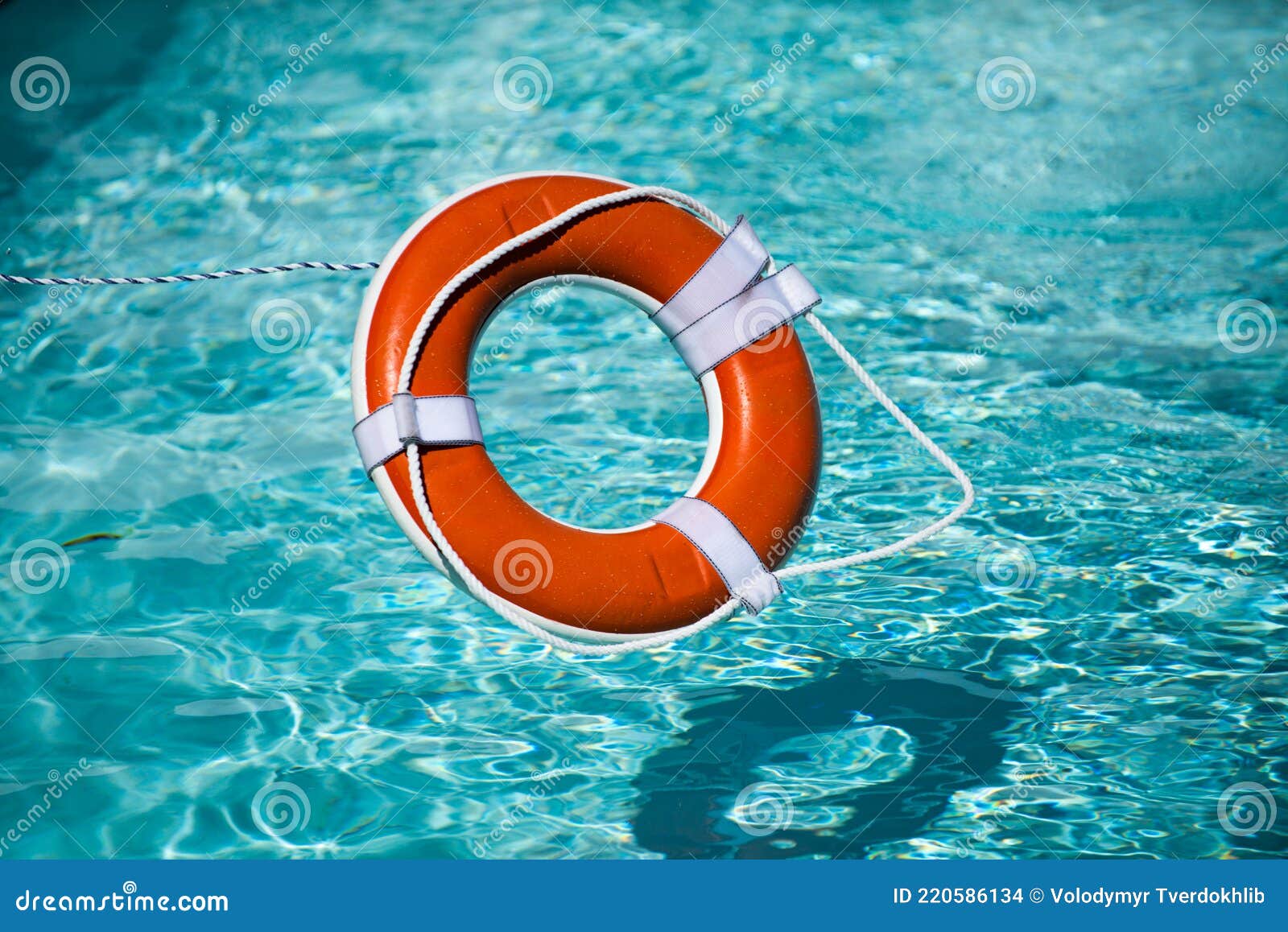 Lifebuoy Pool Ring Float on Blue Water. Stock Photo - Image of ...