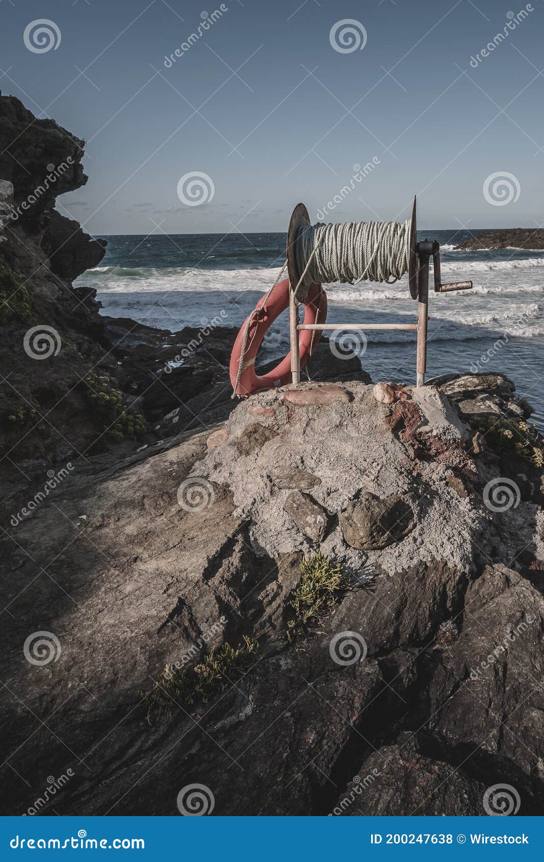 Lifebuoy With A Rope Is At The Edge Of Water On The Beach Royalty-Free ...