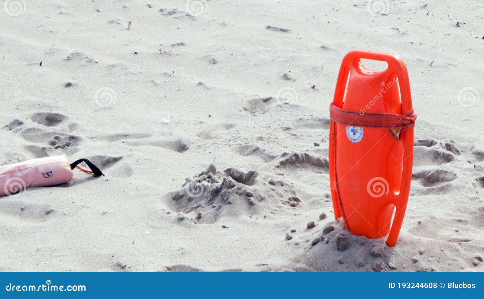 Lifeguard Board Stuck in the Sand on the Beach, Ready for Rescue Stock ...