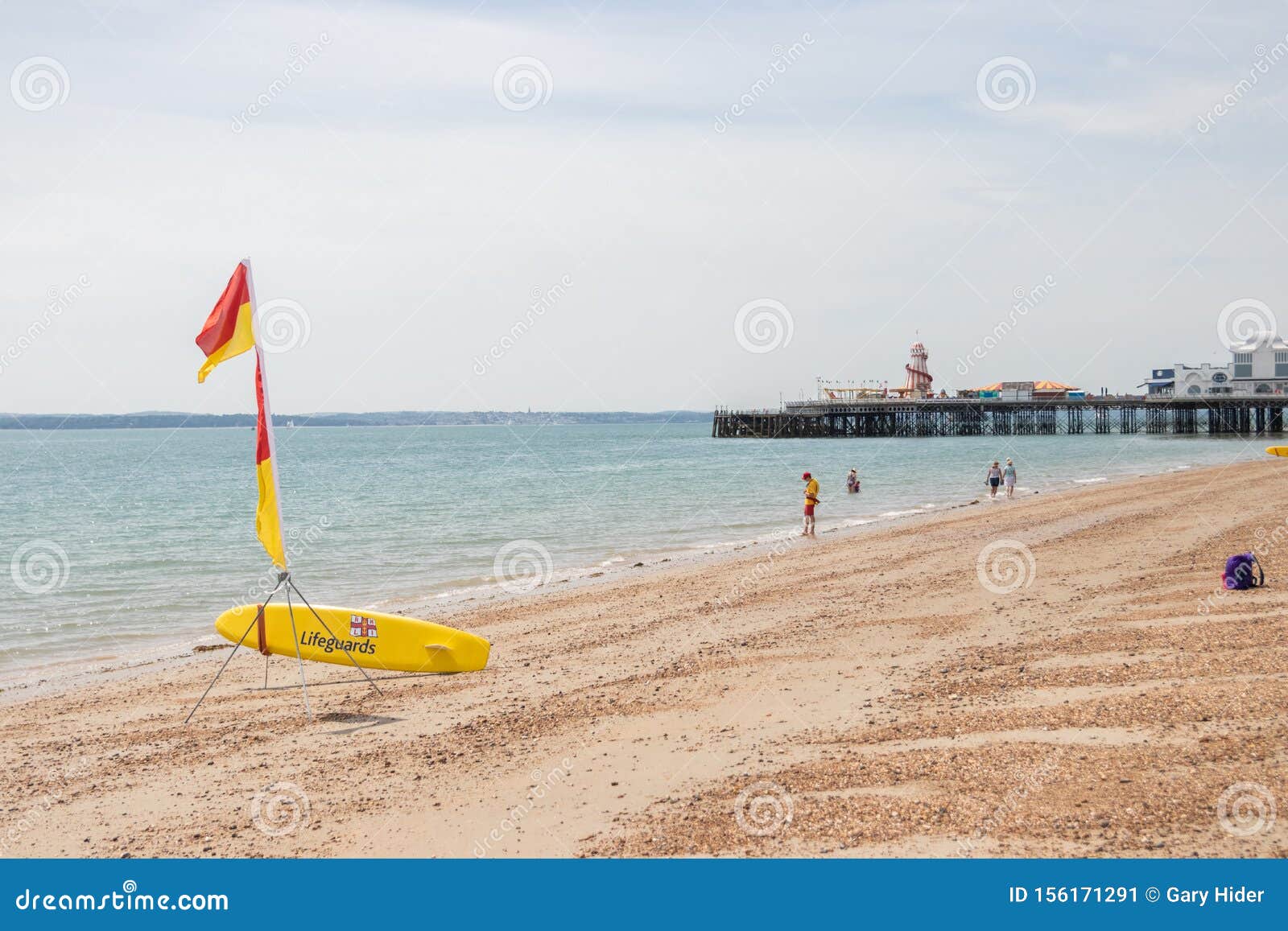A Lifeguard Flag and Surfboard on a British Beach Editorial Photo ...