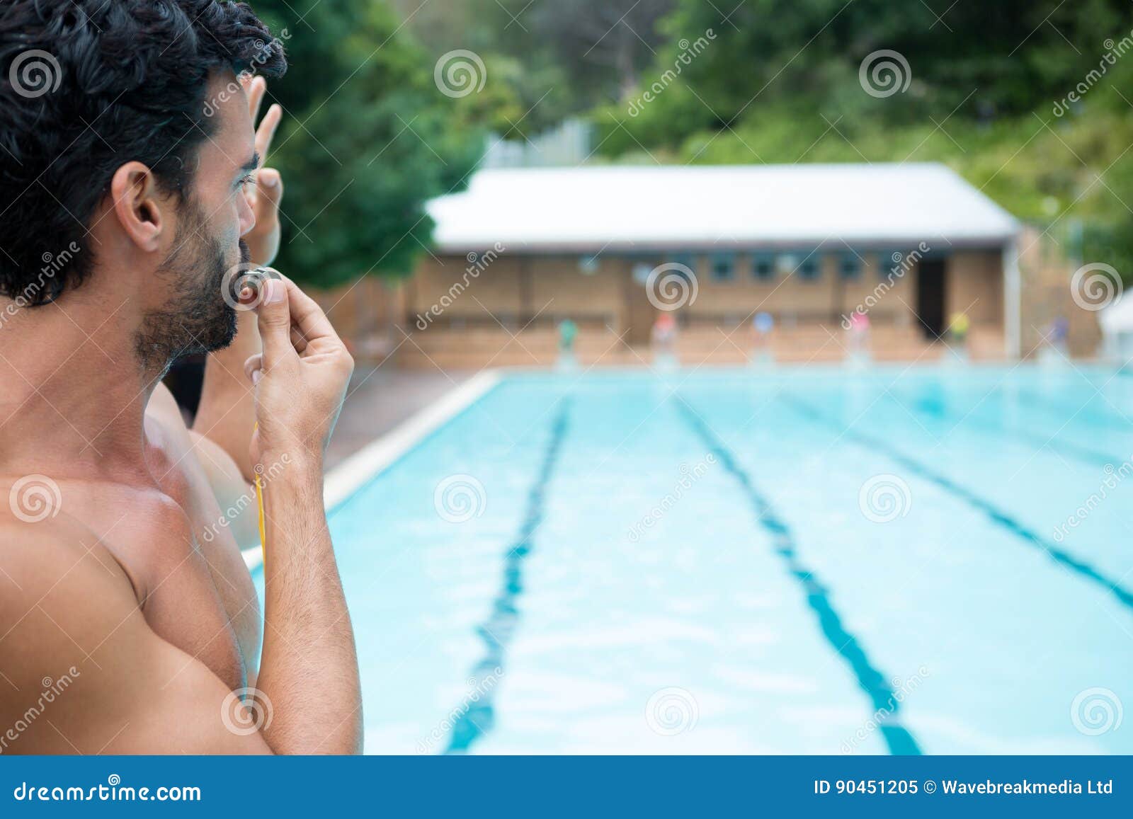 Lifeguard Looking at Swimming Pool and Blowing Whistle Stock Image ...