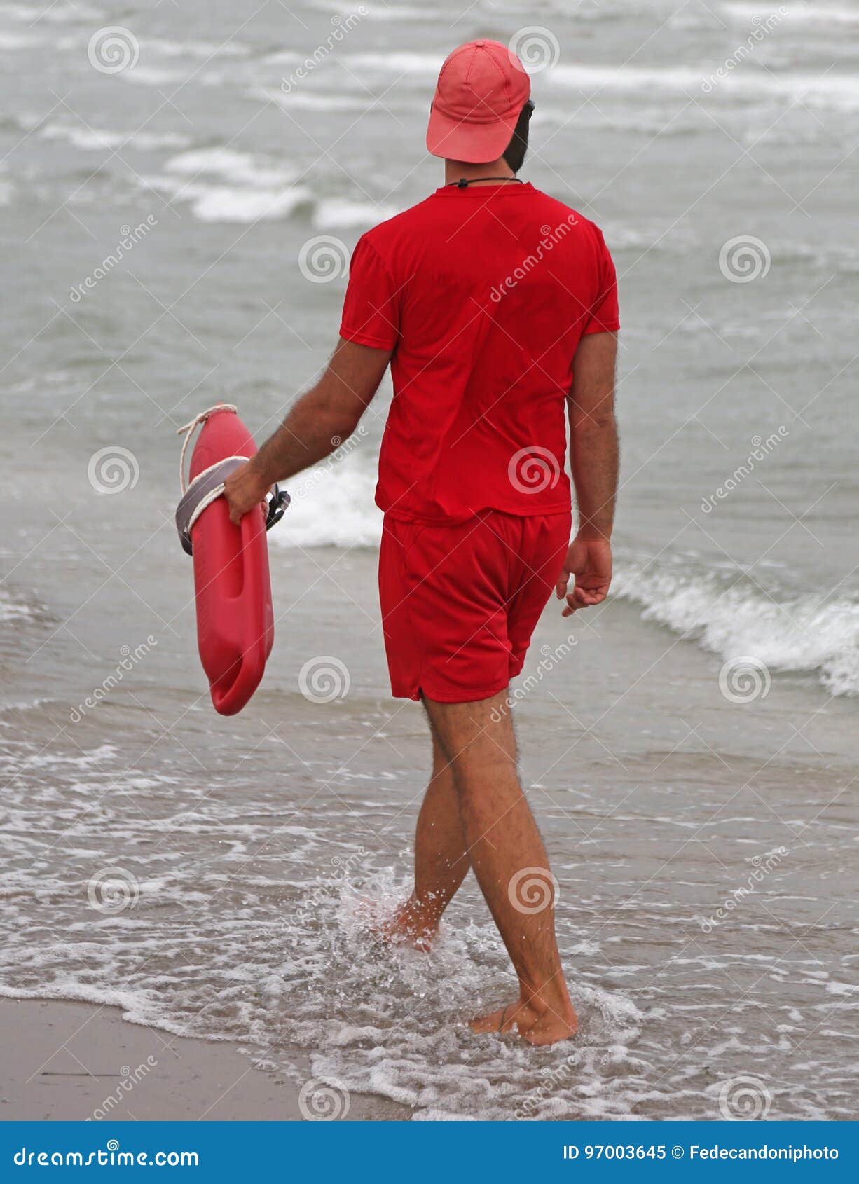 Lifeguard with Red Uniform Controls Bathers Editorial Image - Image of ...