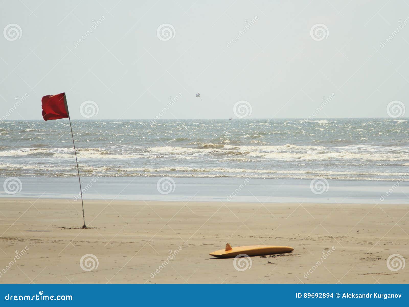 Lifeguard Surfboard and Red Flag on the Beach Stock Photo - Image of ...