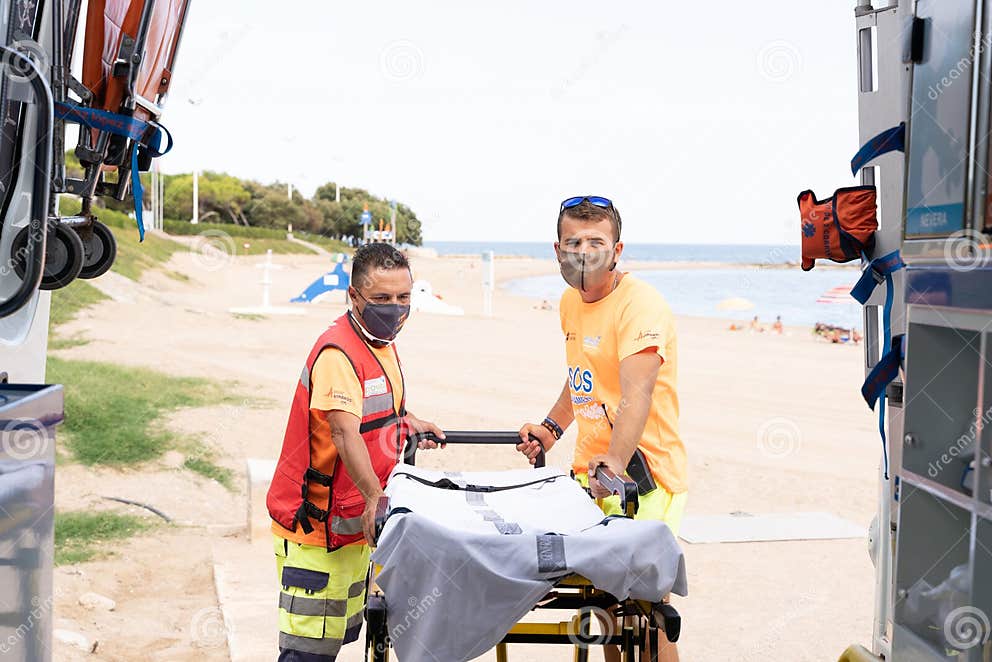Lifeguard Team Working on the Beach Using a Stretcher Stock Image ...