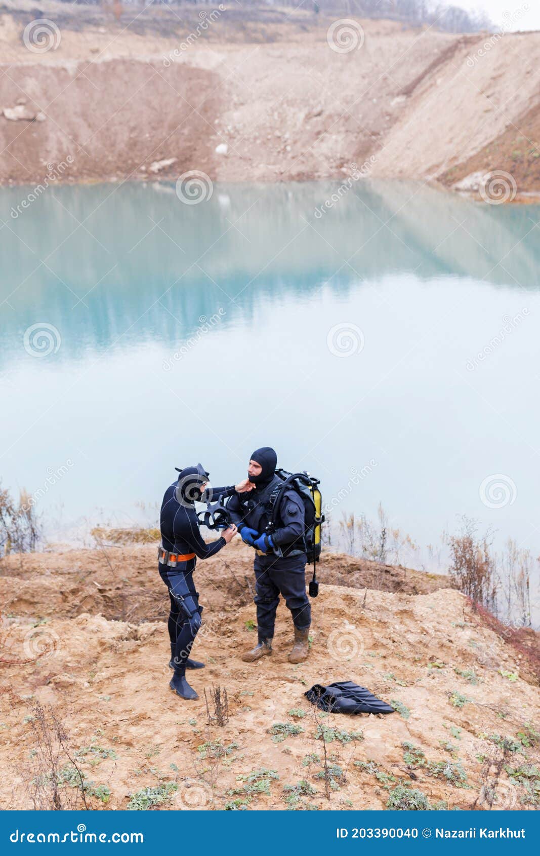 Lifeguard in a Wetsuit To Work Underwater. Search at the Bottom of the ...